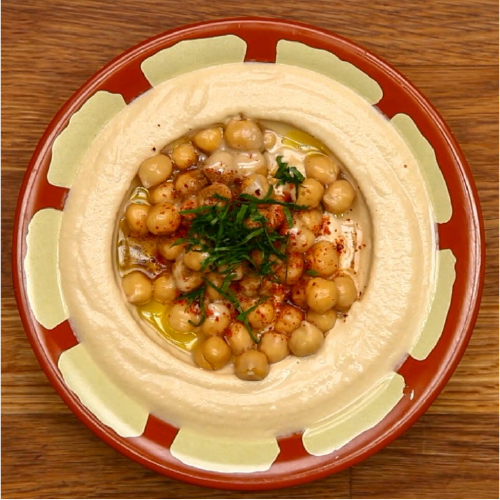 صحن حمص بالطحينة مع نكهة مميزة ولذيذة من شطة وليمون
